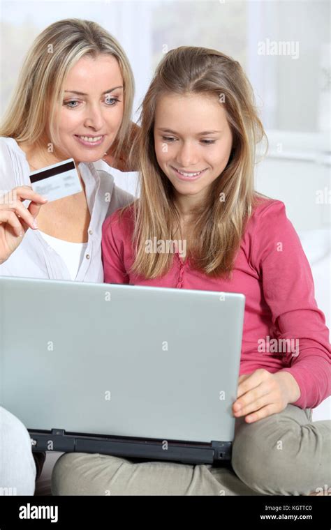 Mother And Daughter Shopping On Internet Stock Photo Alamy