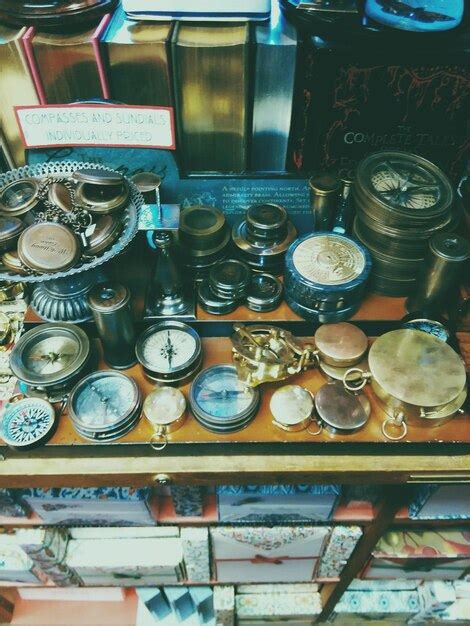 Premium Photo Close Up Of Hand Compasses On Table