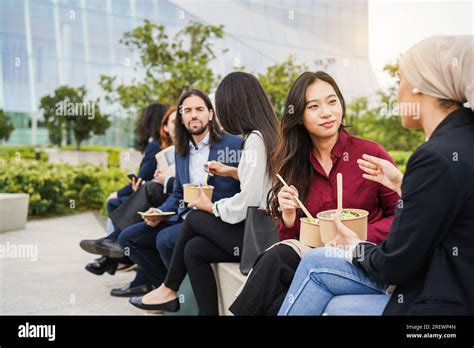 Business People Doing Lunch Break With Healthy Fast Food Outdoor From