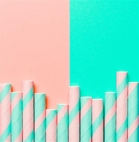 Premium Photo Striped Paper Straws On Pink And Blue Background