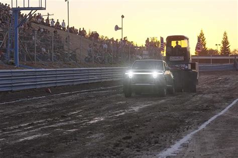 Rivian R T Vs F Lightning In A Ton Towing Contest Edmunds