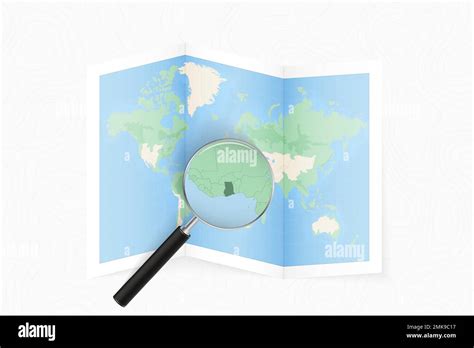 Enlarge Ghana With A Magnifying Glass On A Folded Map Of The World Vector Paper Map Stock