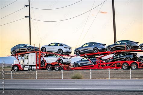Long Freight Big Rig Classic Car Hauler Semi Truck Transporting Cars On