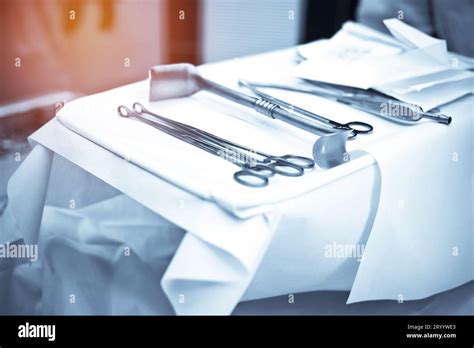 Surgery Instrument And Tools Set On White Sterile Fabric In Operating