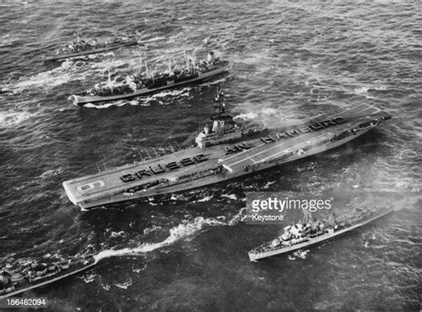The Crew Of American Navy Aircraft Carrier Uss Essex Organised To
