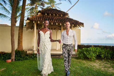 Ambiguous Gender Fluid Person In White Bridal Dress Holds Hands With