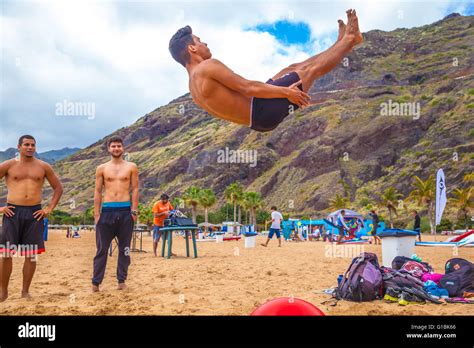 Public Exhibition Of Martial Arts Tricking Sports On The Beach Stock