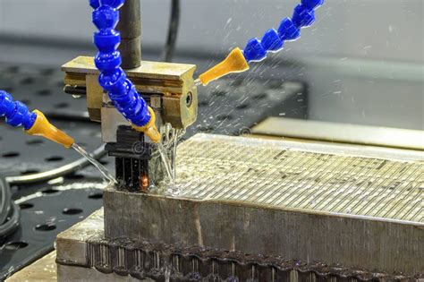 The Graphite Electrode Working On EDM Machine With Liquid Coolant