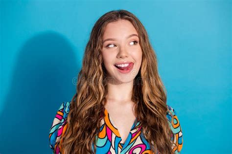 Photo Of Lovely Young Girl Lick Teeth Look Empty Space Wear Top