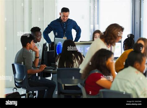 Junior High Babes And Teacher Using Computers In Computer Lab Stock