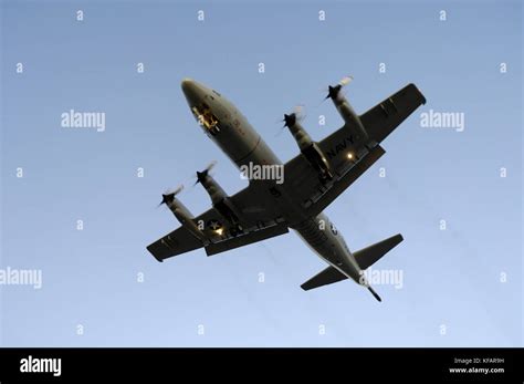 A Us Navy Lockheed P 3c Orion On Final Approach With Black Engine Smoke