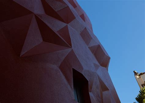 Gg Loop Transforms Italian House With Red Faceted Facade