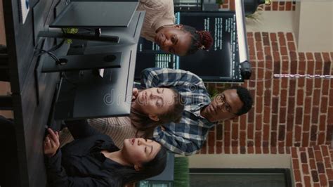 Vertical Video Software Engineers Brainstorming Ideas Looking At Code