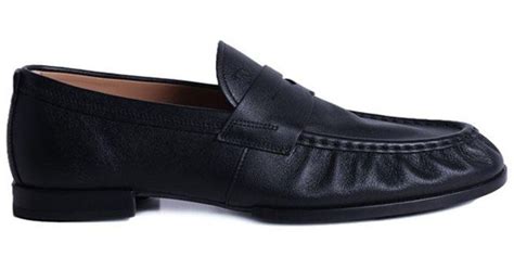 Tods Logo Embossed Slip On Penny Loafers In Black For Men Lyst Uk