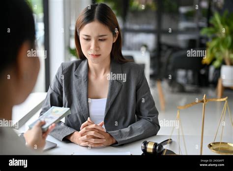 Stressed Asian Female Lawyer Or Business Legal Consultant Refusing