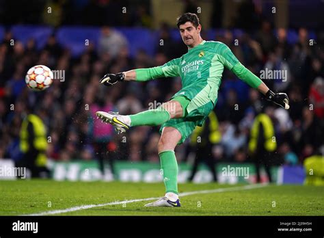 Real Madrid Goalkeeper Thibaut Courtois Clears The Ball During The UEFA