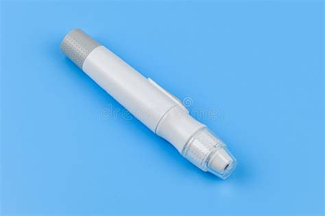 Glucometer Isolated On A Blue Background Medical Device For Measuring