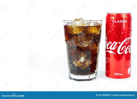 Glass Of Cold Refreshing Coca Cola Soda With Ice Metal Can Of Coca