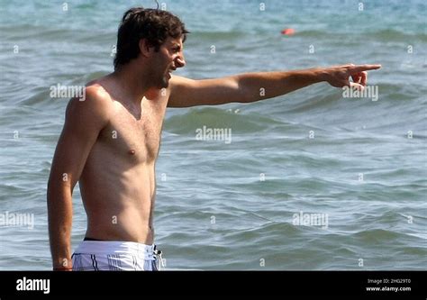 Football Player Diego Milito Spending A Day On The Beach With His Son Leandro And Wife Sofia At