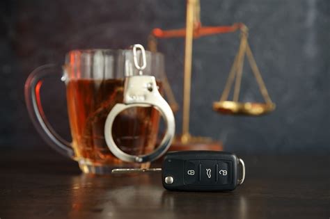 Premium Photo The Concept Of A Dui Law Hammer Alcohol And Car Keys