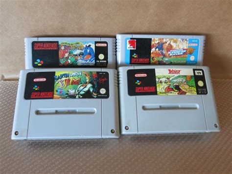 4 Jeux Nintendo Super NES PAL FR Yoshi Island Asterix Soccer Kaufen Auf Ricardo