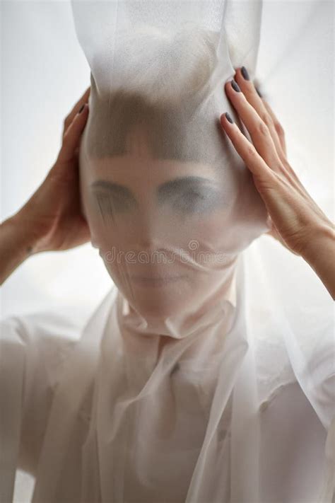 Woman Portrait Pulling Fabric Over Her Face Hiding Face Mask Stock