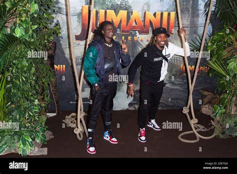 Salif Gueye And Guest Attends The Jumanji Next Level Paris Film