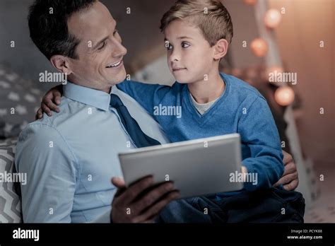 Attentive Boy Listening To His Daddy Stock Photo Alamy
