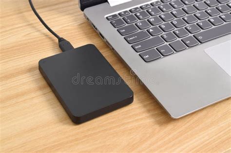 External Backup Hard Disk Drive Connected To Laptop On Wooden Table Stock Photo Image Of
