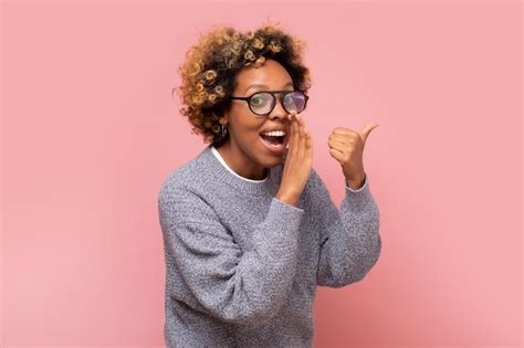 Premium Photo Young African American Woman With Hand On Mouth Telling
