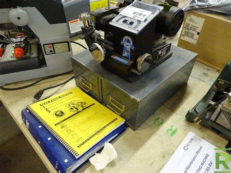 hpc blitz code key cutting machine and parts bin with contents roller
