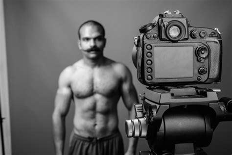 Premium Photo Portrait Of Shirtless Man Photographing