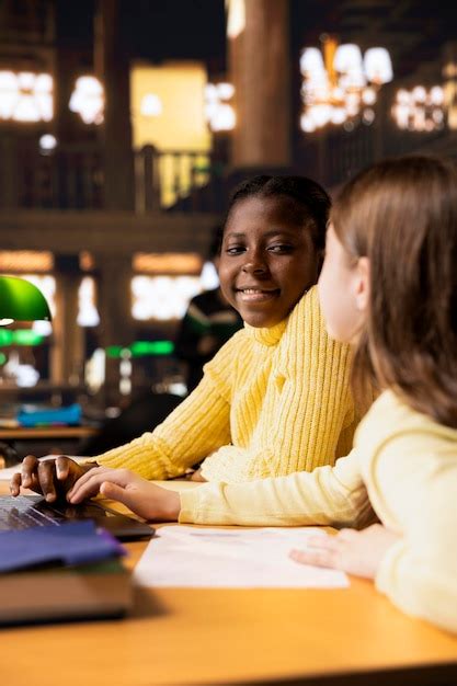 Pupils Participating In An Online Class At The Library Joining A Live