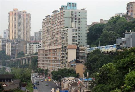 Watch This Train Runs Through A Building In China S Mountain City