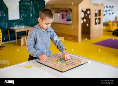 Exploring Basic Math And Geometry Concepts With Geoboard Stock Photo