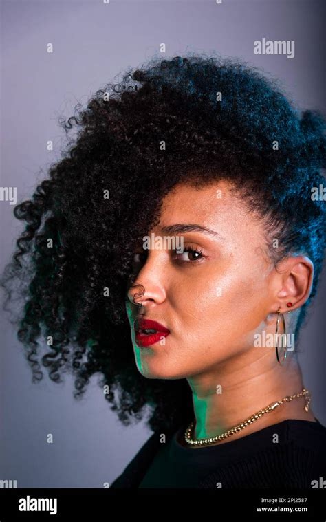 Vertical Close Up Portrait Of Beautiful Young Woman With Hair To Her