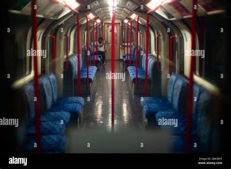 A Man Sits On In A Near Empty Central Line Carriage As The Uk Continues