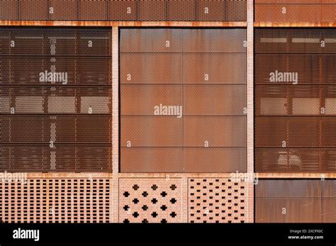 Facade With Patchwork Pattern Of Brick And Stretch Metal Of The Multi