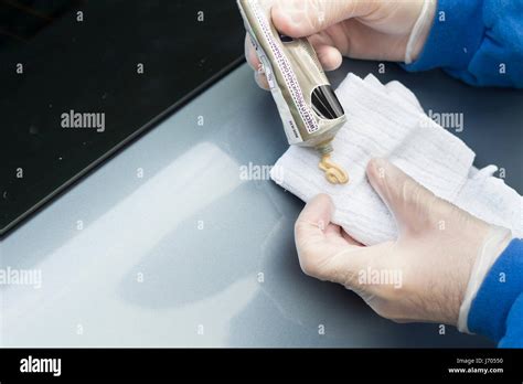 The Hands Of A Man Apply Polishing Paste On A White Cloth Stock Photo Alamy