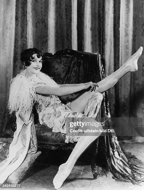 Woman Putting On Her Stockings Photos Et Images De Collection Getty