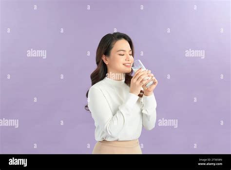 Young Smiling Happy Fun Woman Wear White Clothes Hold In Hand Glass
