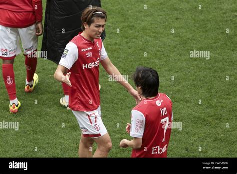 Keito Nakamura Of Reims Salutes Junya Ito Of Reims Following The French