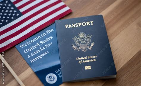 passport of usa united states of america next to a guide for new