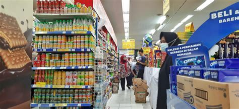 Customer Choosing Various Groceries Products In Grocery Store