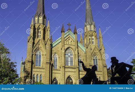St Dunstan`s Basilica Cathedral And The Bronze Statue Of Two Fathers