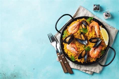 Traditional Spanish Seafood Paella In Pan With Chickpeas Shrimps