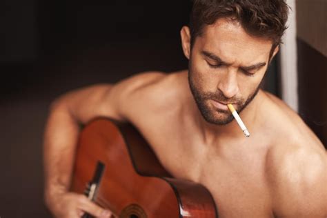 Premium Photo Working On His Latest Song Cropped Shot Of A Shirtless