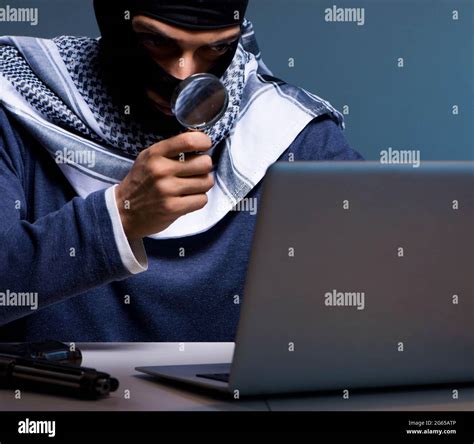 The Hacker Wearing Balaclava Mask Hacking Computer Stock Photo Alamy