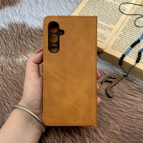 کیف گوشی Galaxy A25 سامسونگ چرم مگنتی جاکارتی بند آویز دار نیلکین