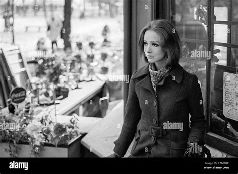 1960s Woman Fashion Model Portrait By Kiosk Looking Away Jardin Des